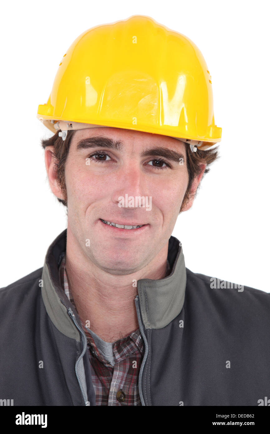 Portrait of a worker with yellow helmet Stock Photo - Alamy