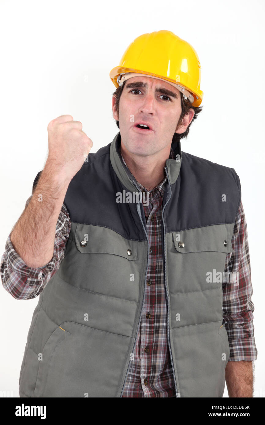 Construction worker raising his fist Stock Photo - Alamy