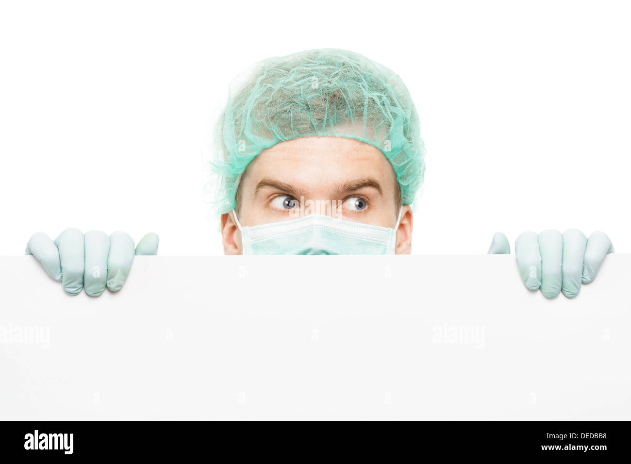 Surgeon squint from behind a board isolated on white background Stock ...