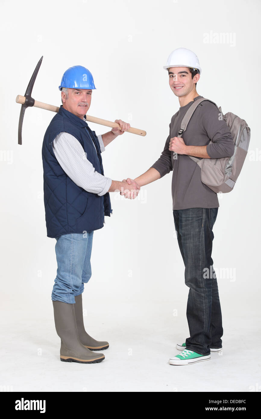 Experienced tradesman meeting his new apprentice for the first time ...
