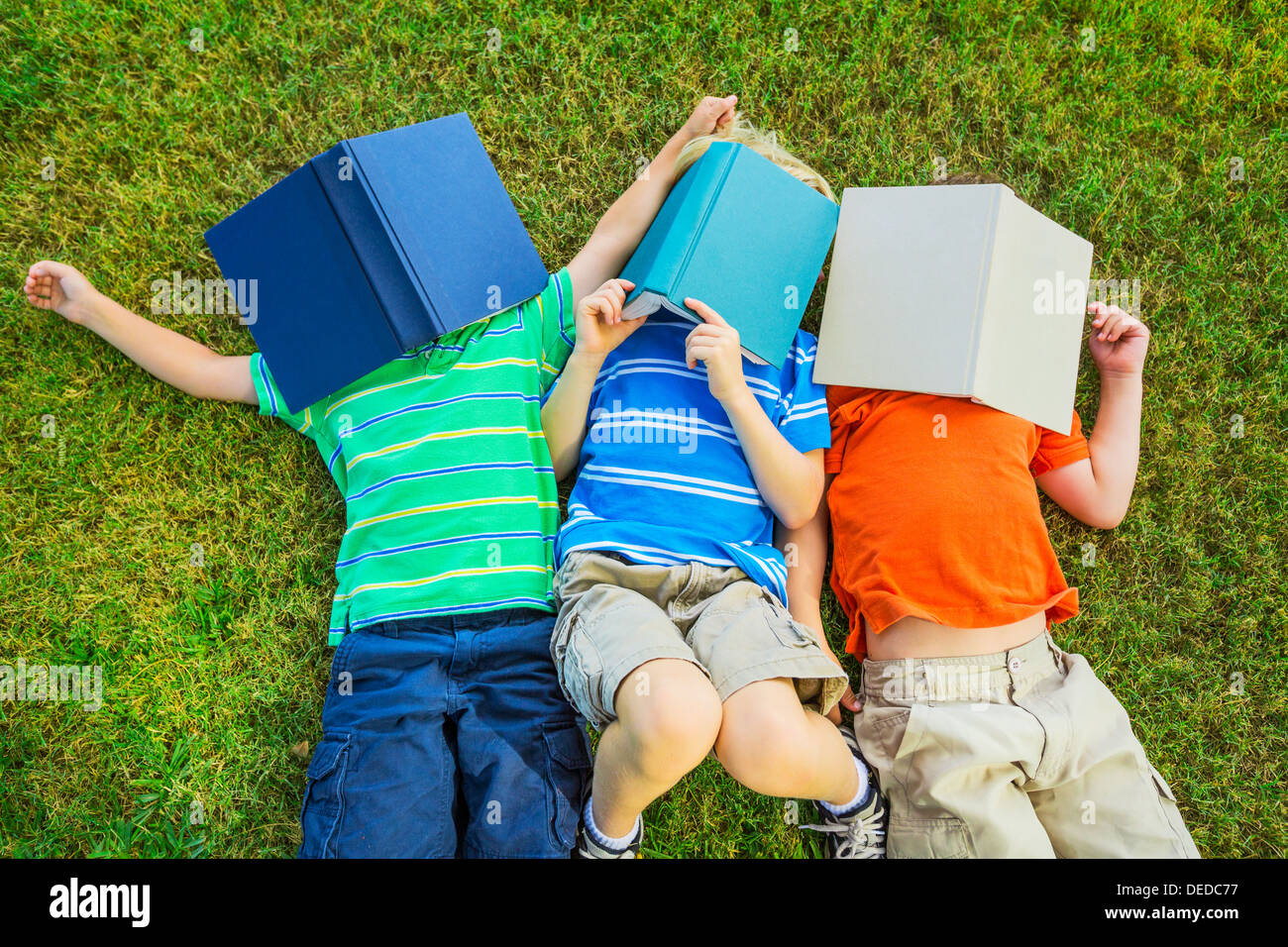Happy Kids, Group of Young Boys Reading Books Outside Together after ...