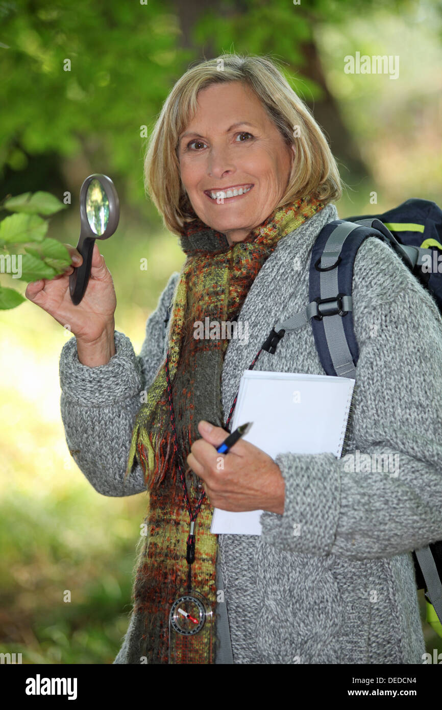 Woman zoom nature magnifying glass hi-res stock photography and images ...