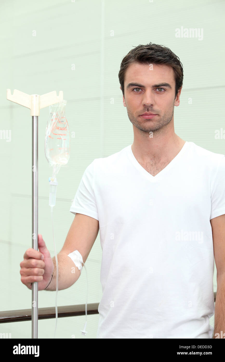 Man stood by drip Stock Photo - Alamy