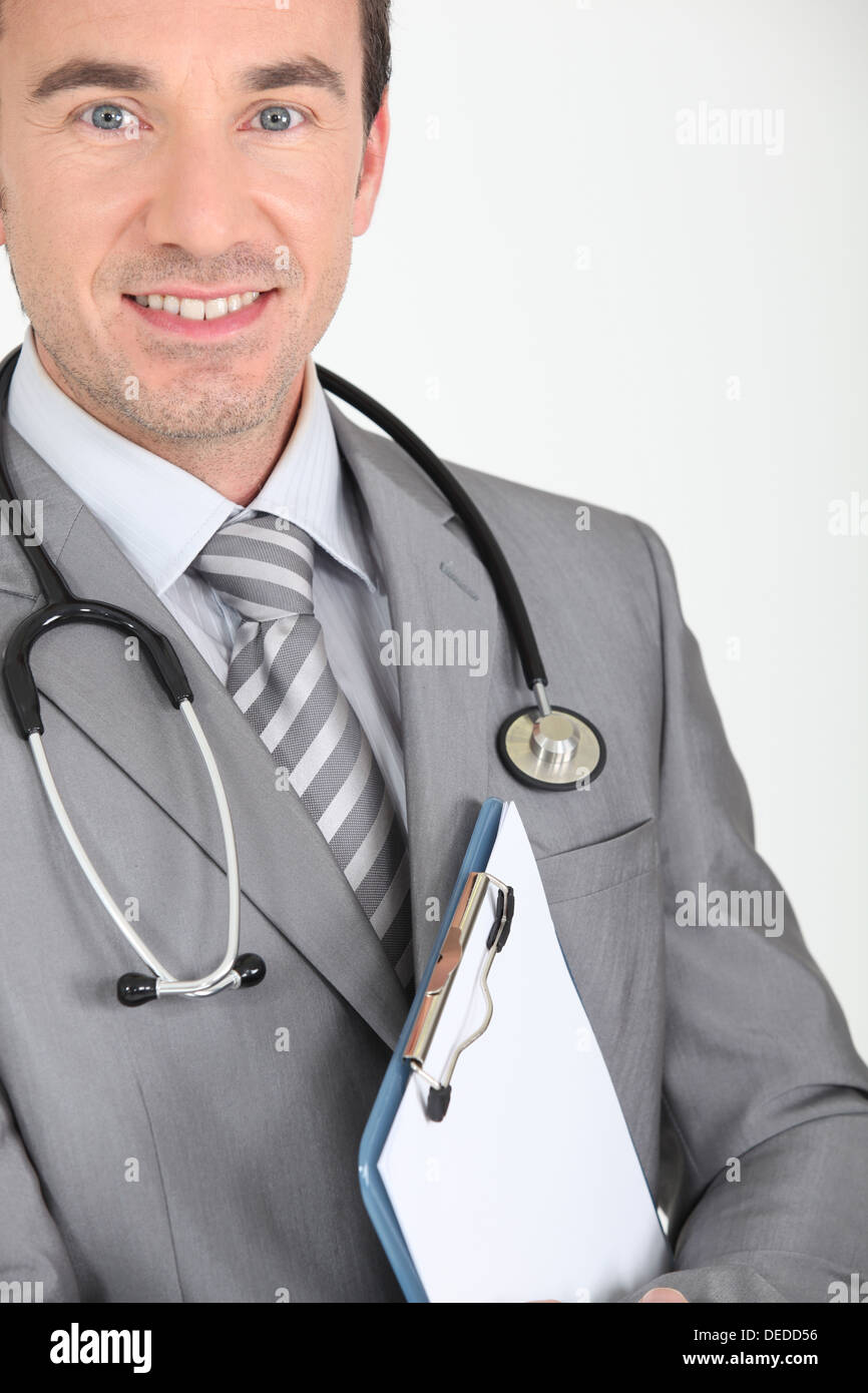 Young doctor with binder Stock Photo - Alamy