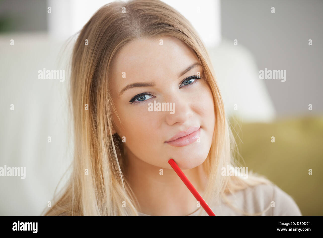 Woman thinking holding pencil hi-res stock photography and images - Alamy