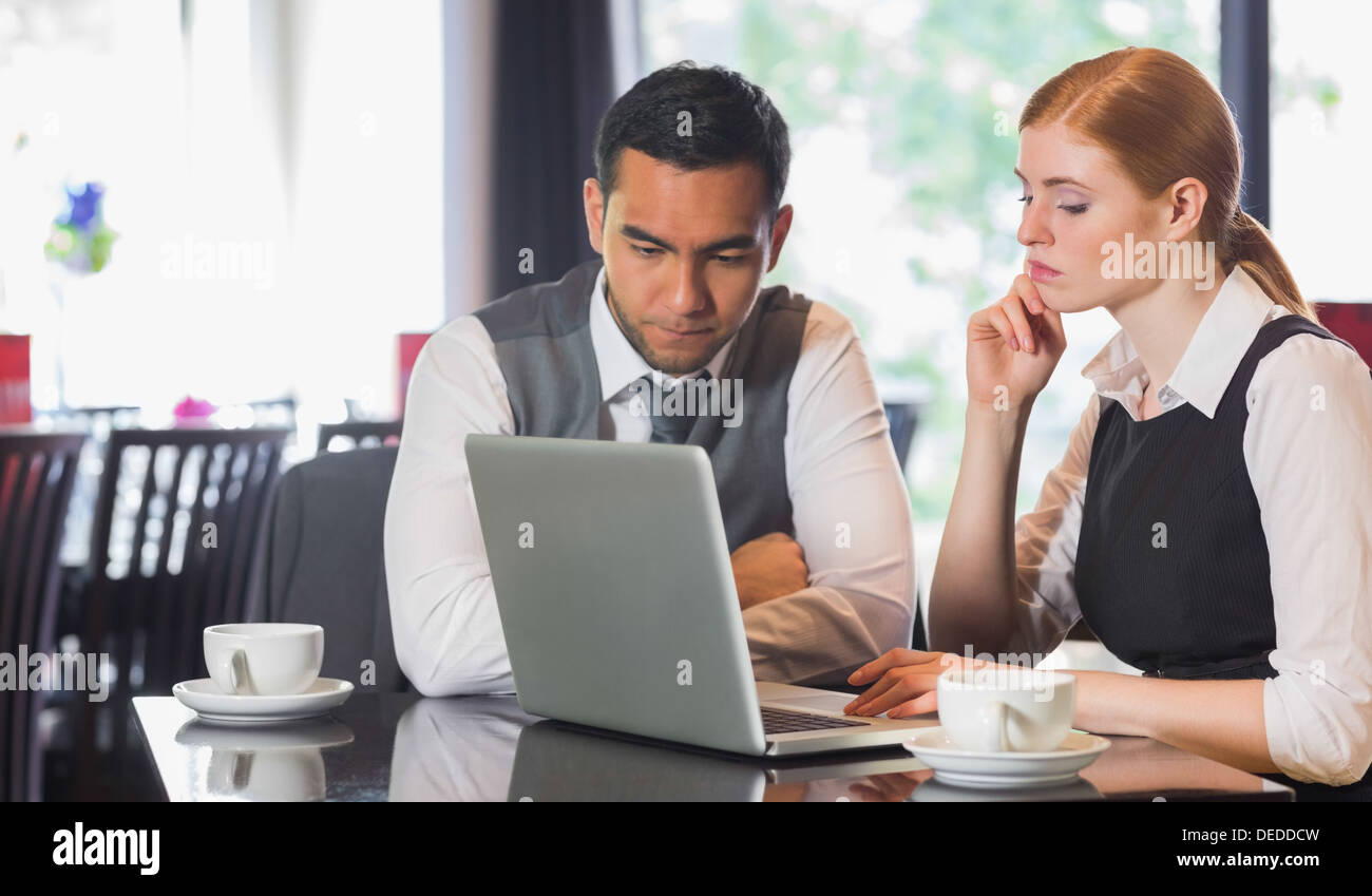 Business team working together in a cafe Stock Photo - Alamy