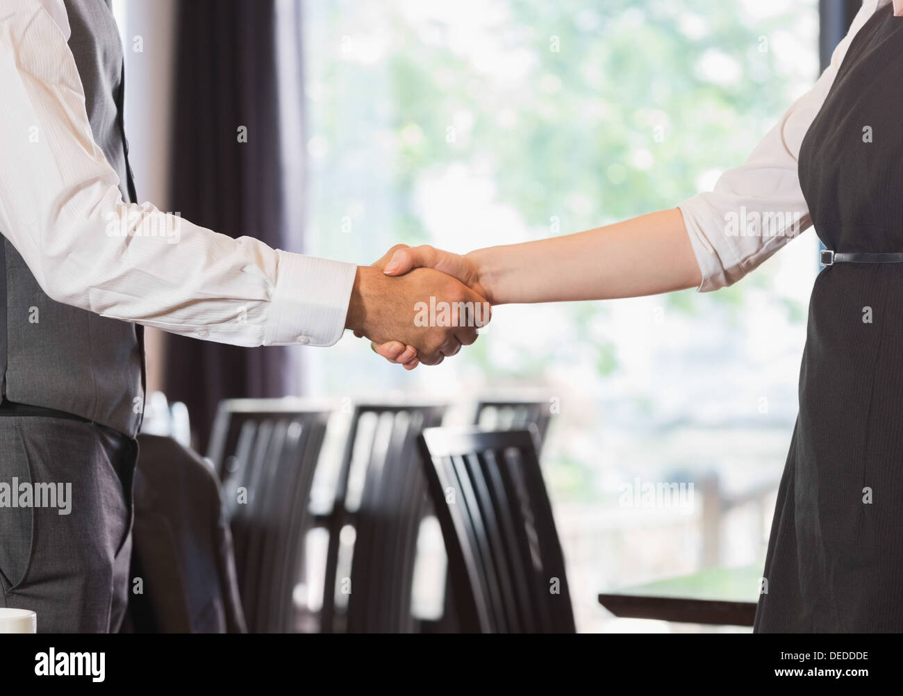 Business team shaking hands Stock Photo - Alamy