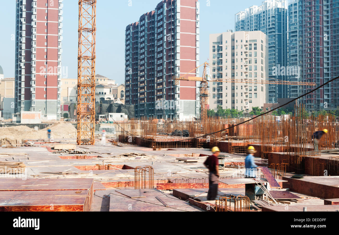 building under construction with workers Stock Photo - Alamy