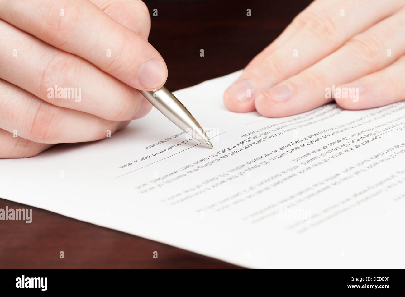 Male hand signing document economy hi-res stock photography and images ...