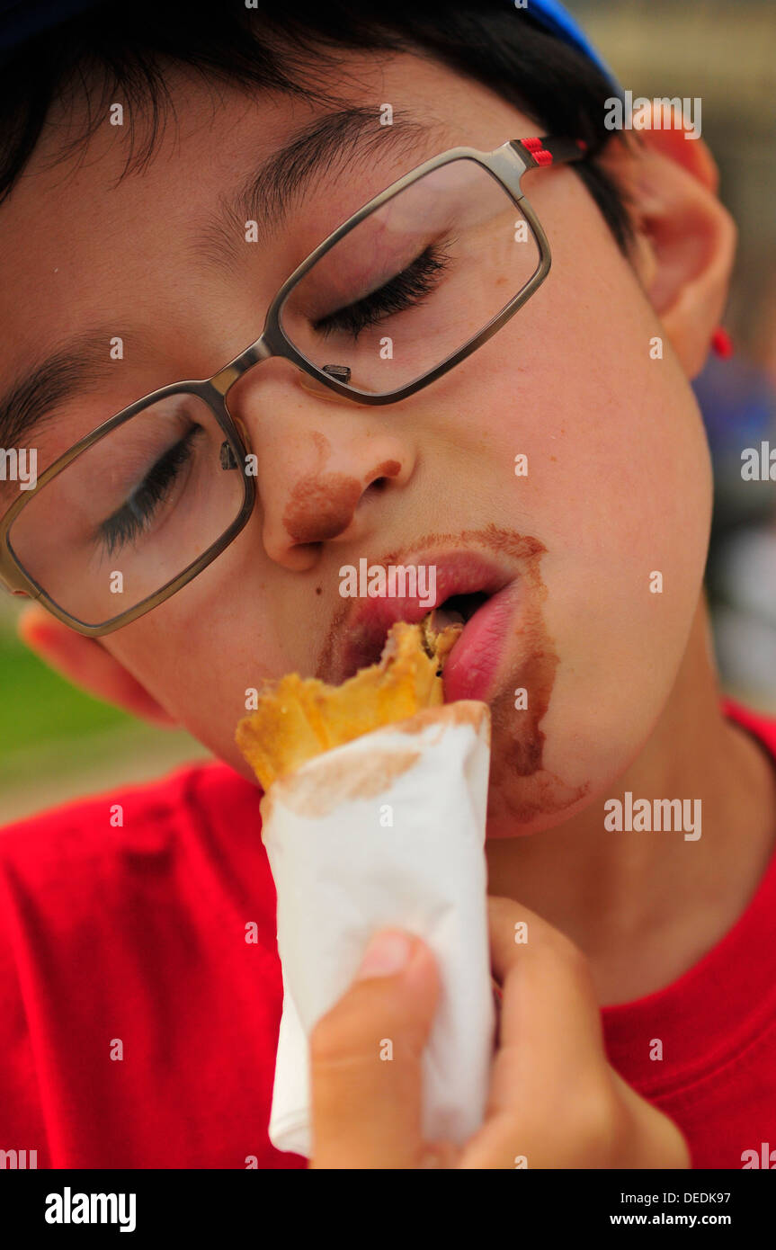 Boy eating chocolate messy hi-res stock photography and images - Alamy