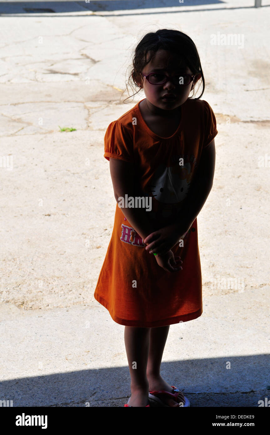Girl stood in Shadow Stock Photo - Alamy