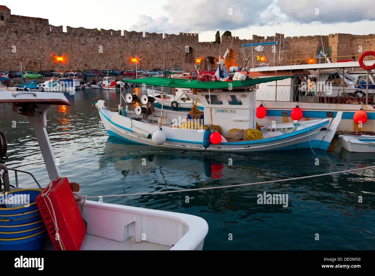 Fishing boats and walls at the commercial port, City of Rhodes, Rhodes ...