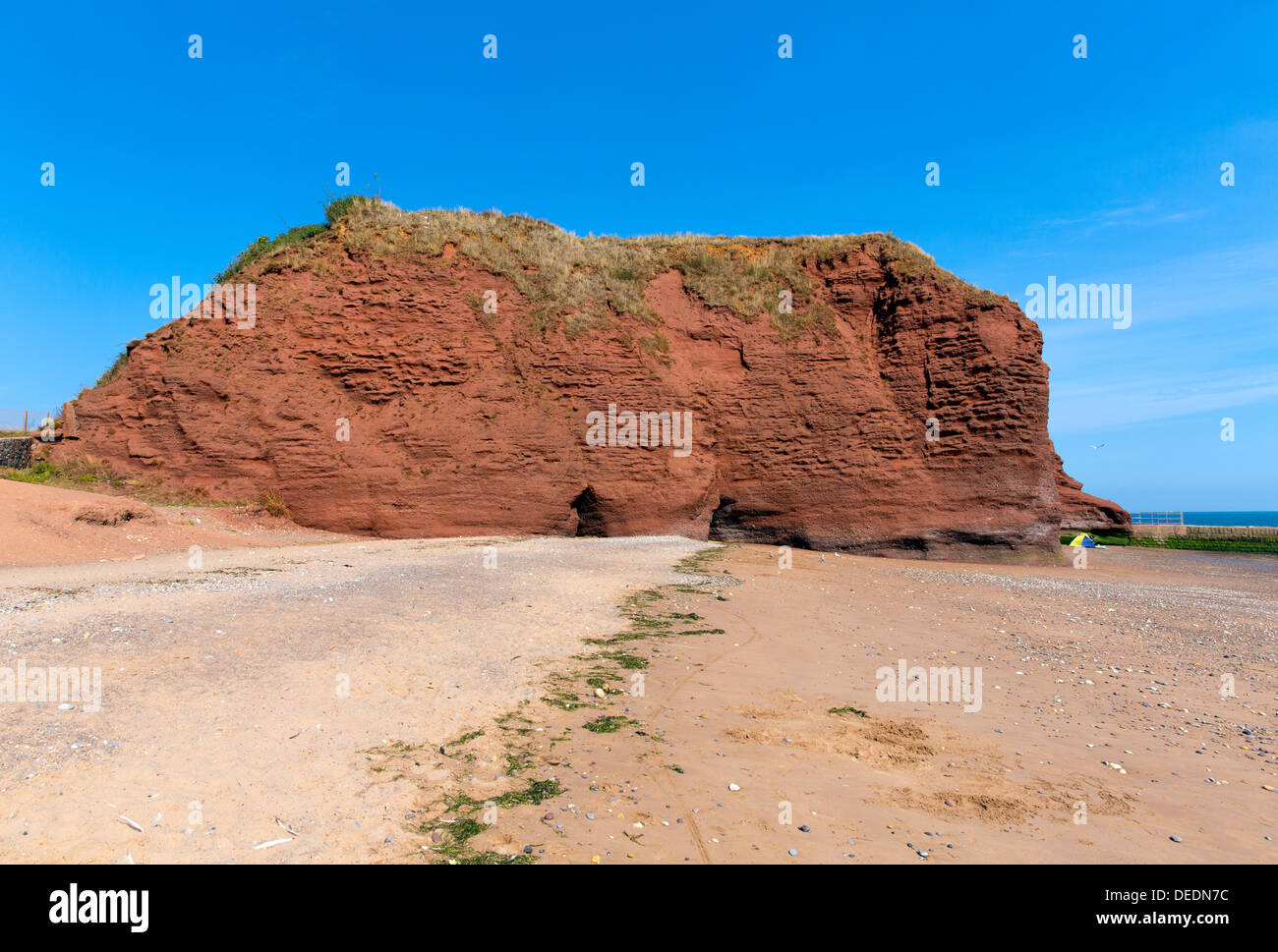 Red rock beach near Dawlish Warren Devon England UK Stock Photo - Alamy