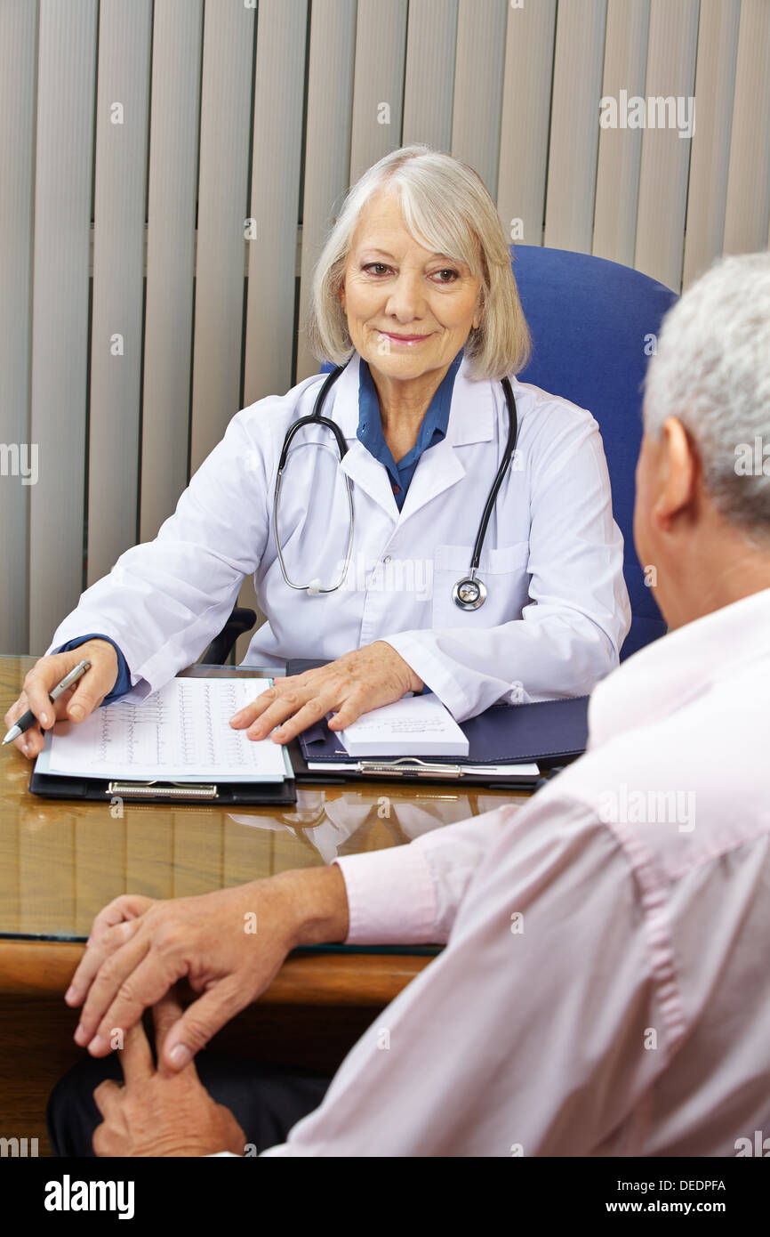 Doctor at a consultation with patient in her office Stock Photo - Alamy