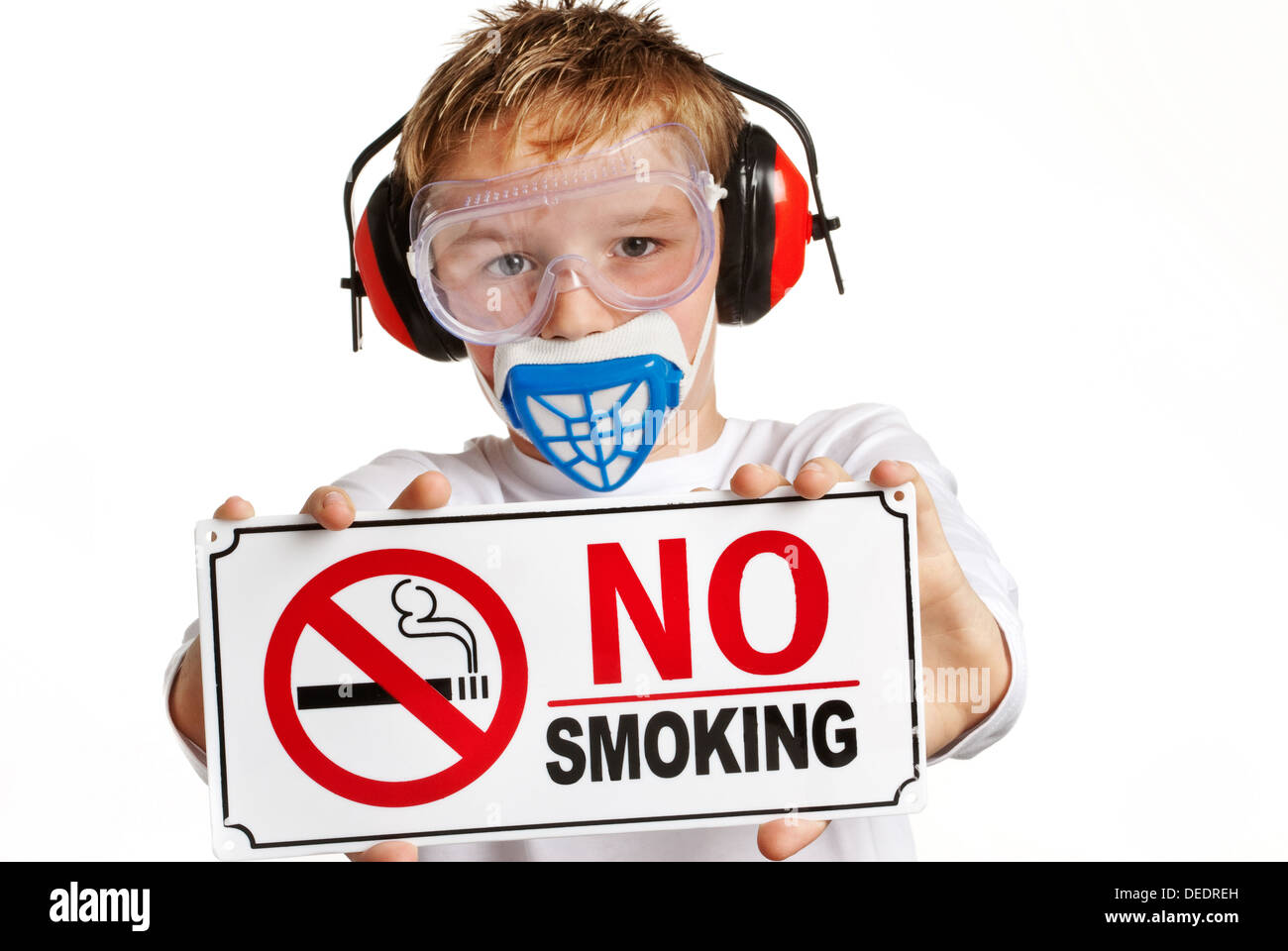 Boy with ear protection and face mask holding no smoking sign Stock ...