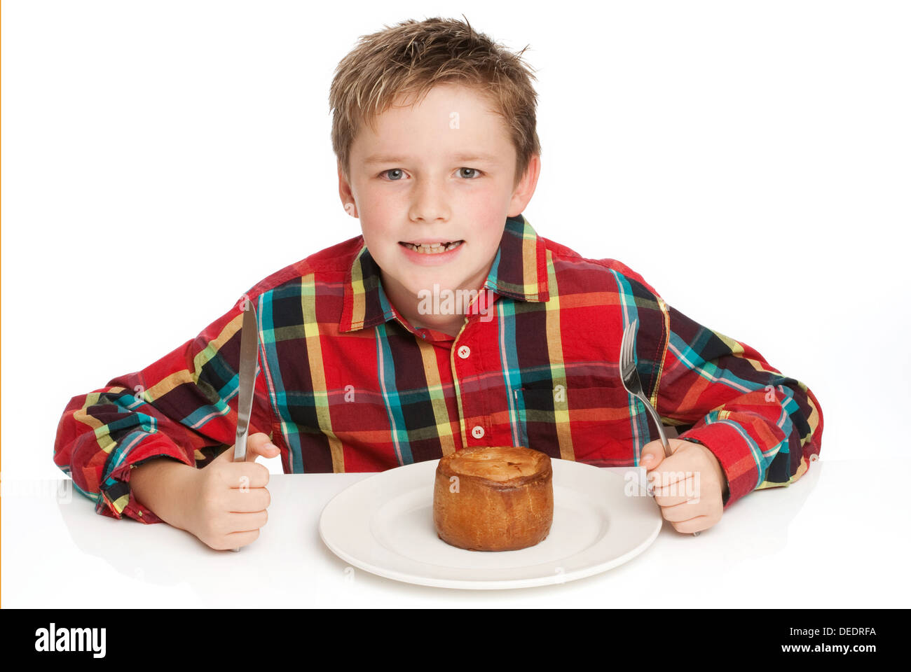 Boy eating pork pie. Studio white background Stock Photo - Alamy