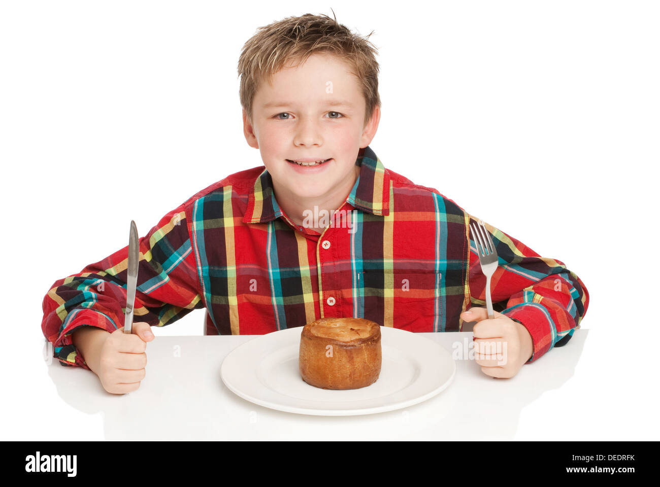 Boy eating pork pie. Studio white background Stock Photo - Alamy