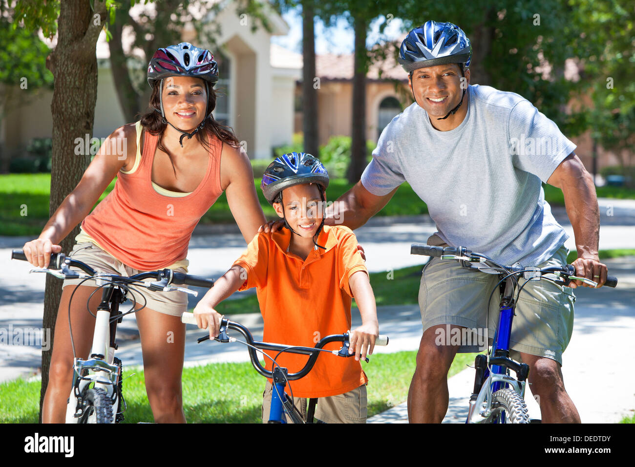 A young African American family, woman, man, father, mother & boy child ...