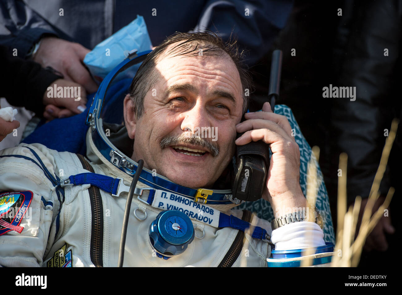 The Expedition 36 crew, including cosmonauts and astronauts, lands ...