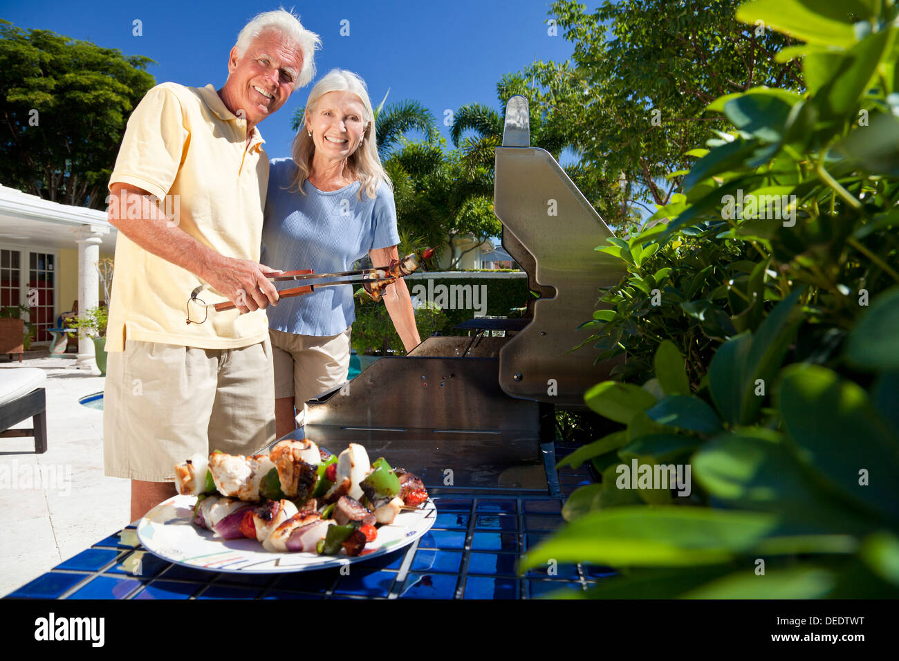 Old woman cooking hi-res stock photography and images - Alamy