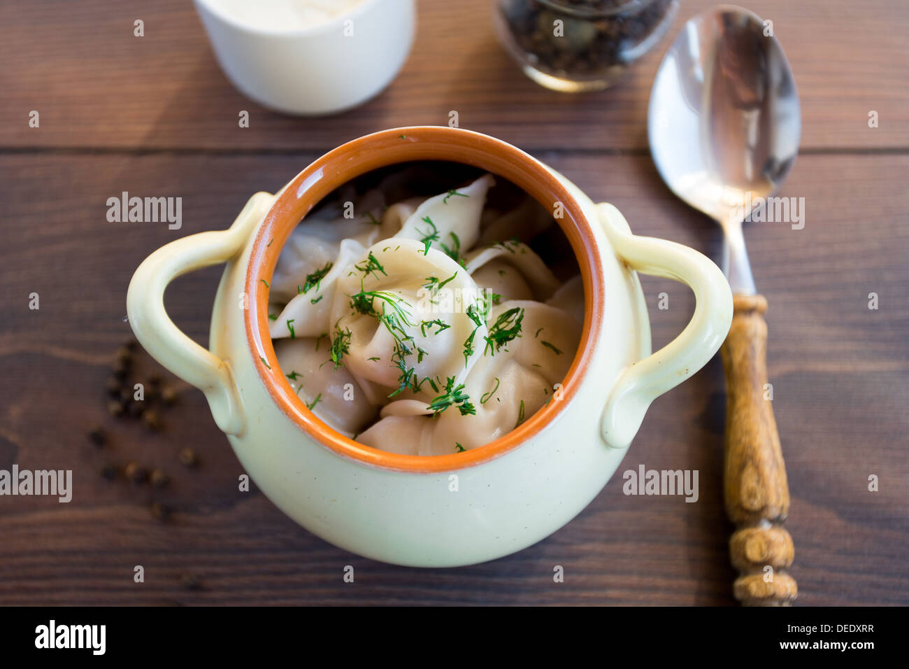 Fresh boiled meat dumplings served with dill Stock Photo - Alamy