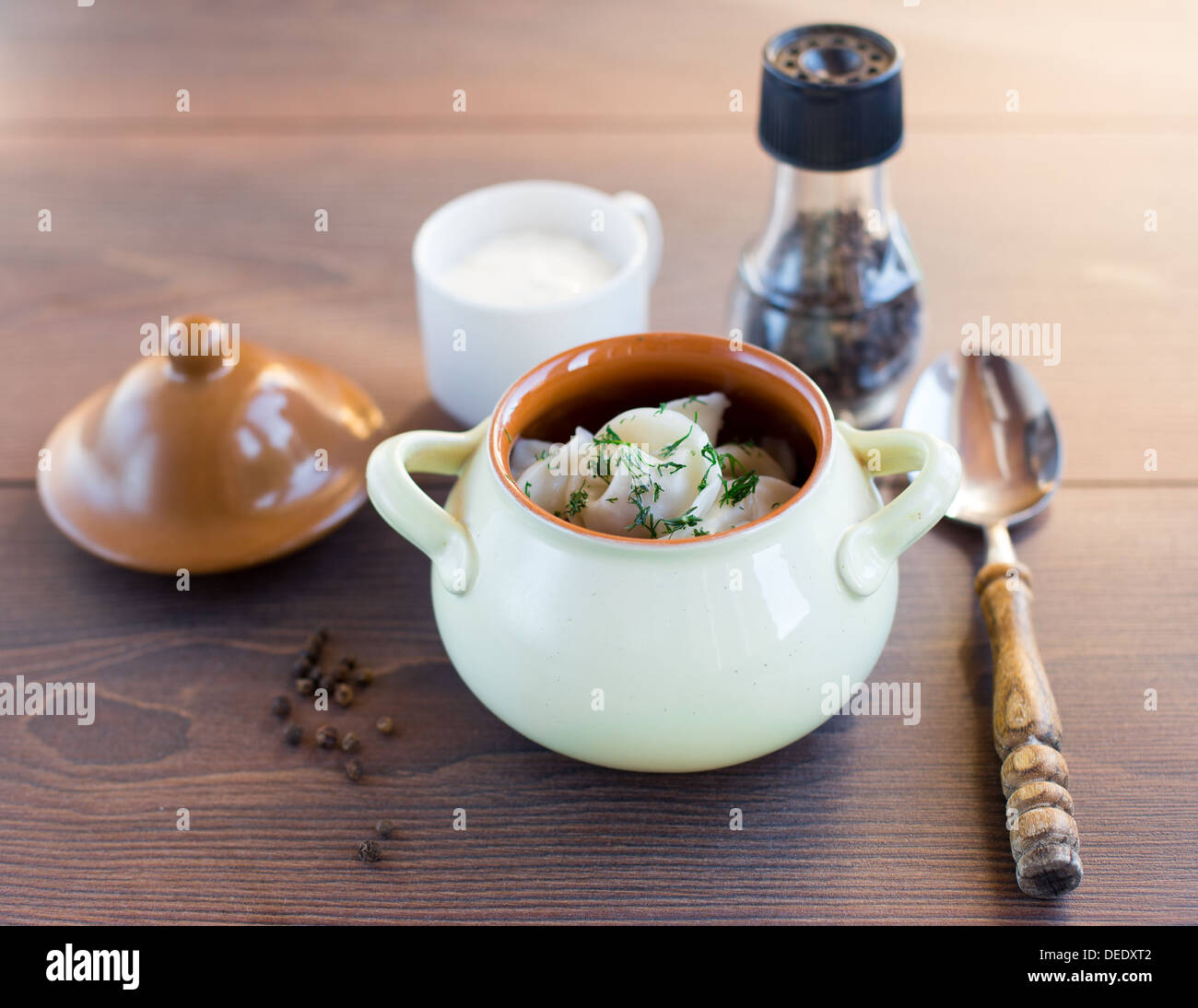 Fresh boiled meat dumplings served with dill Stock Photo - Alamy