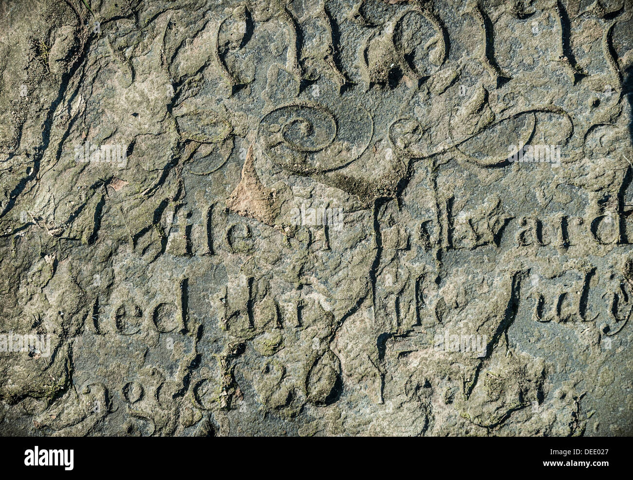 Old 17th century gravestone lettering badly eroded Stock Photo - Alamy