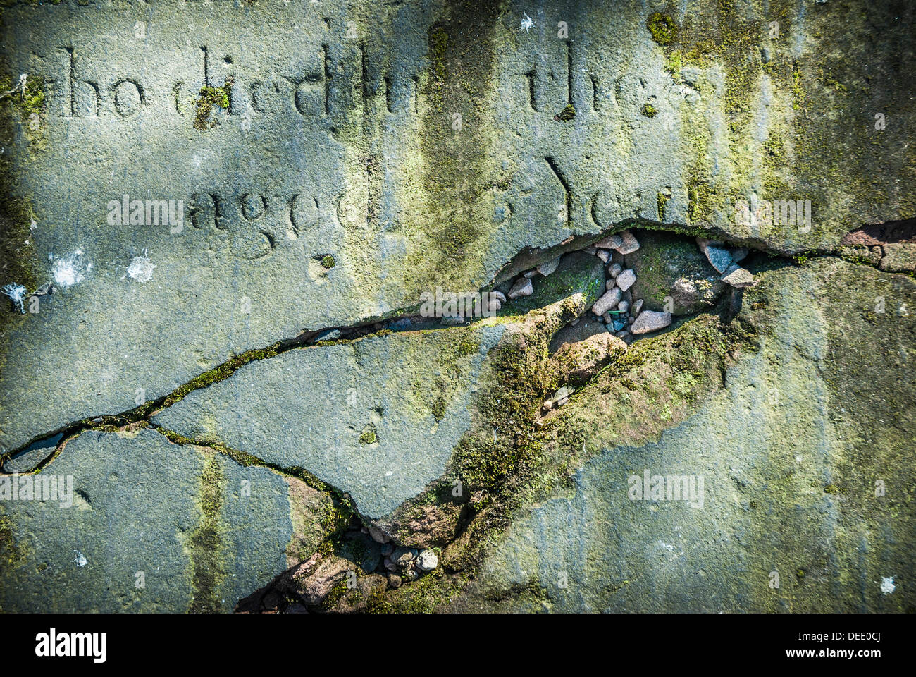 Old 17th century gravestone broken and badly eroded Stock Photo - Alamy