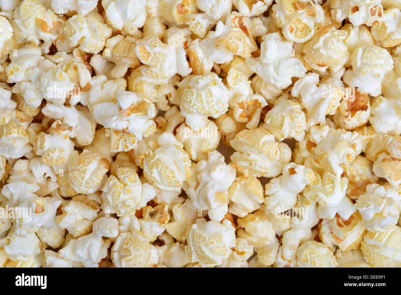 Popcorn close-up on whole background Stock Photo - Alamy
