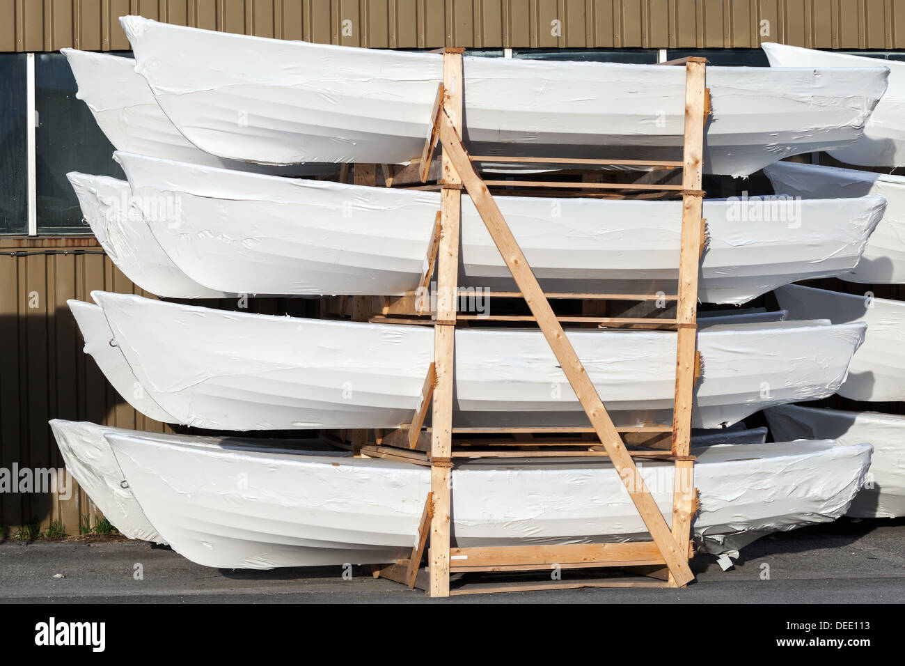 Stack of small white new packed boats in Norwegian shipyard Stock Photo ...