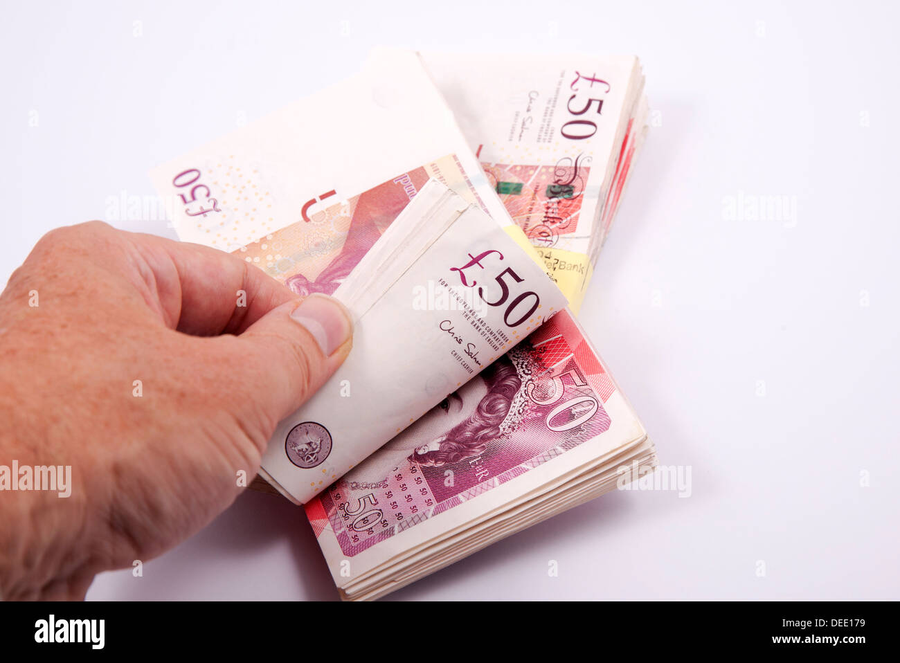 Pounds sterling bundle cash money hi-res stock photography and images ...