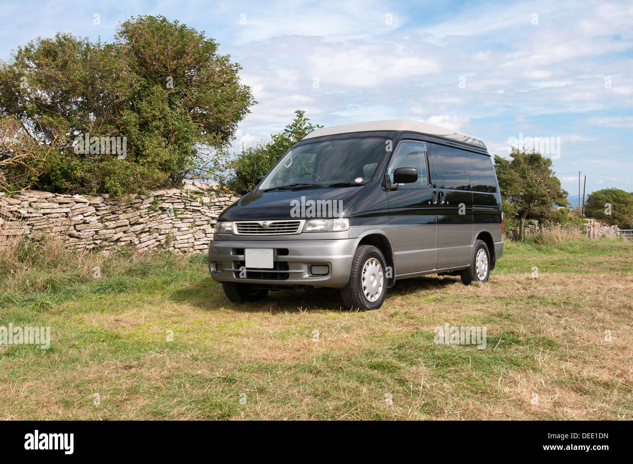 Mazda Bongo MPV van parked in a campsite Stock Photo - Alamy