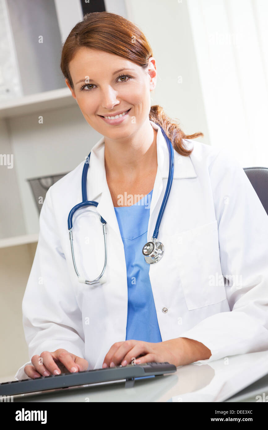 Woman female medical doctor using computer in her hospital office Stock ...