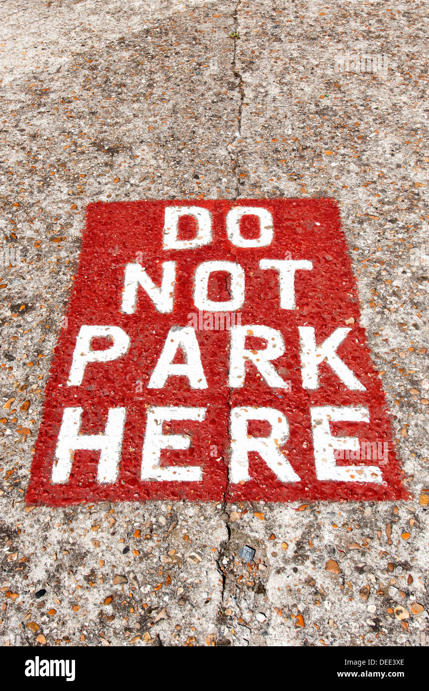 do not park here sign painted on the road Stock Photo - Alamy