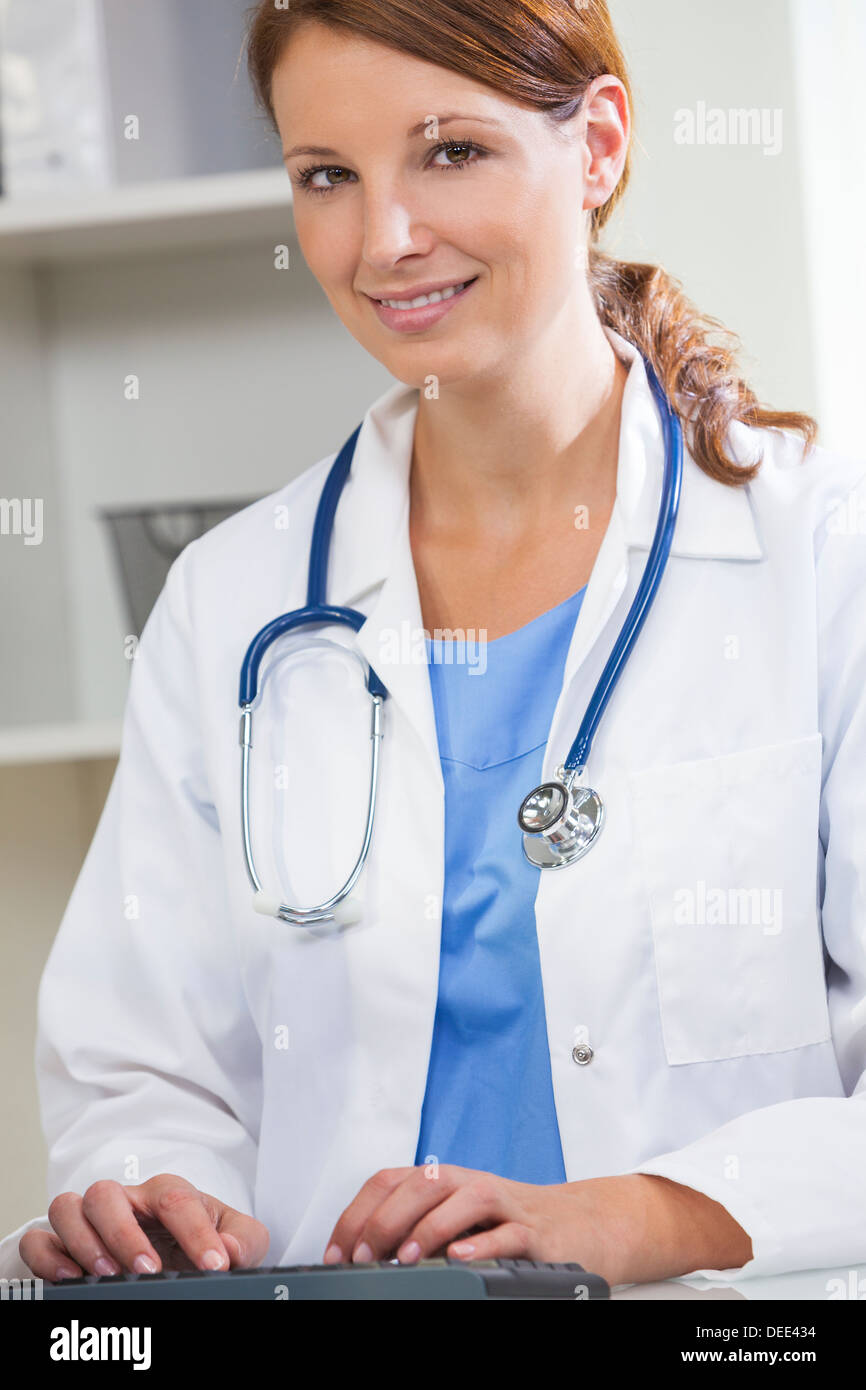 Woman female medical doctor using computer in her hospital office Stock ...