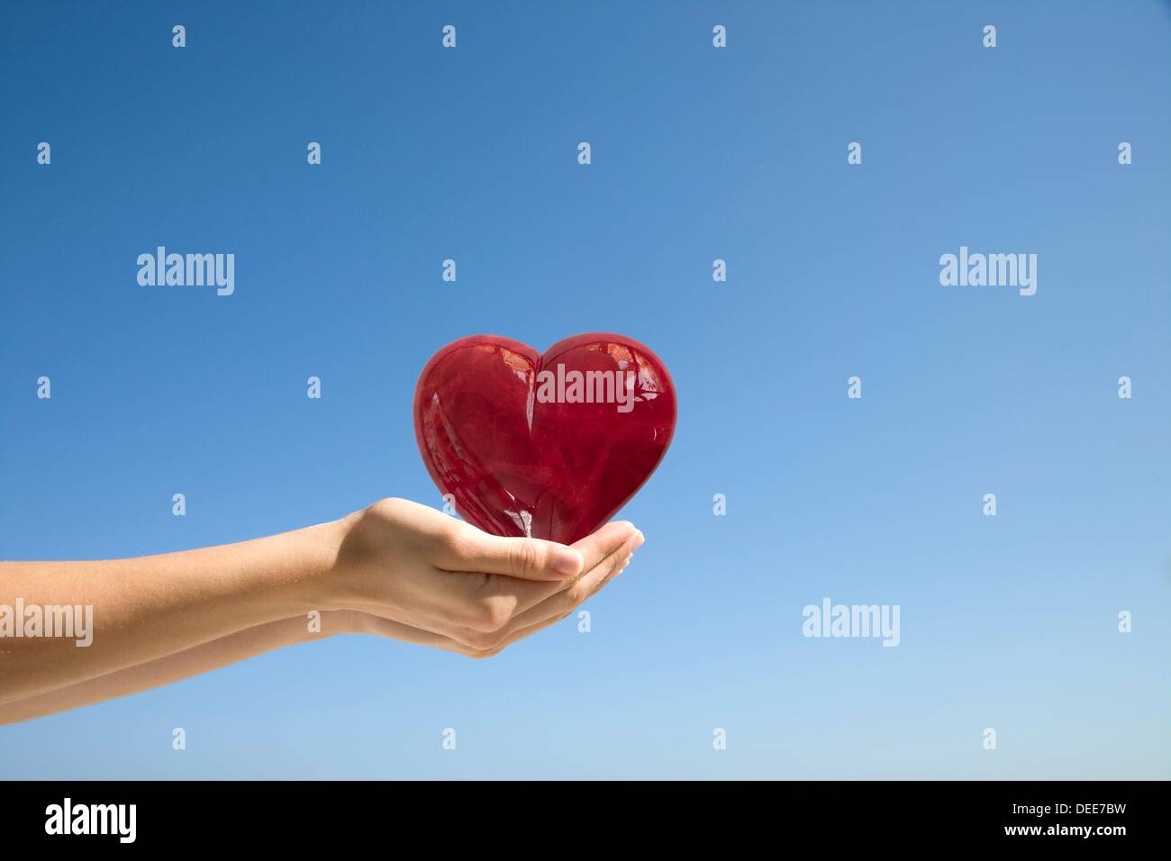 Hand giving heart hi-res stock photography and images - Alamy