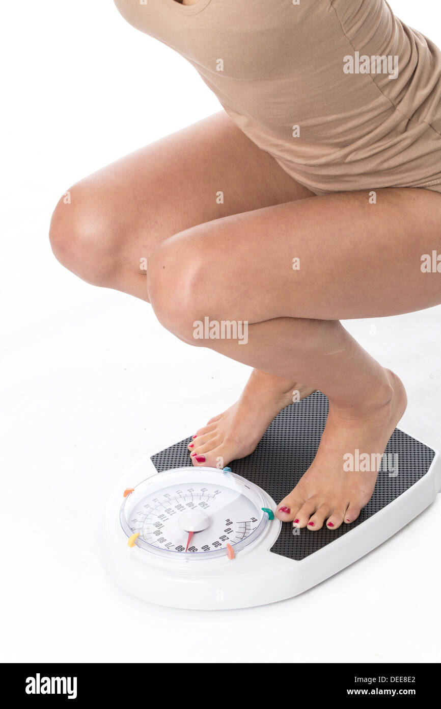 Confident Positive Young Woman, Checking Her Weight On Bathroom Scales ...