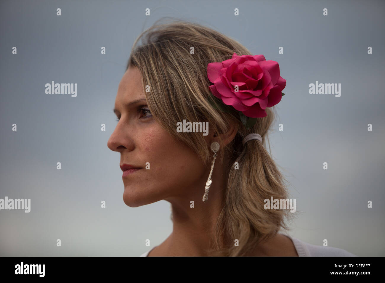 A pilgrim wears a pink flower in her head during the pilgrimage to the ...