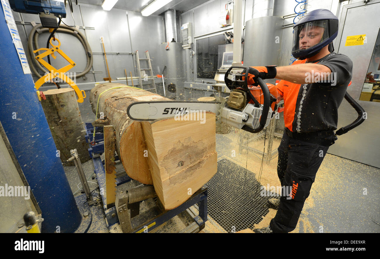 An employee of saw manufacturer Stihl works on the new saw model 'STIHL ...