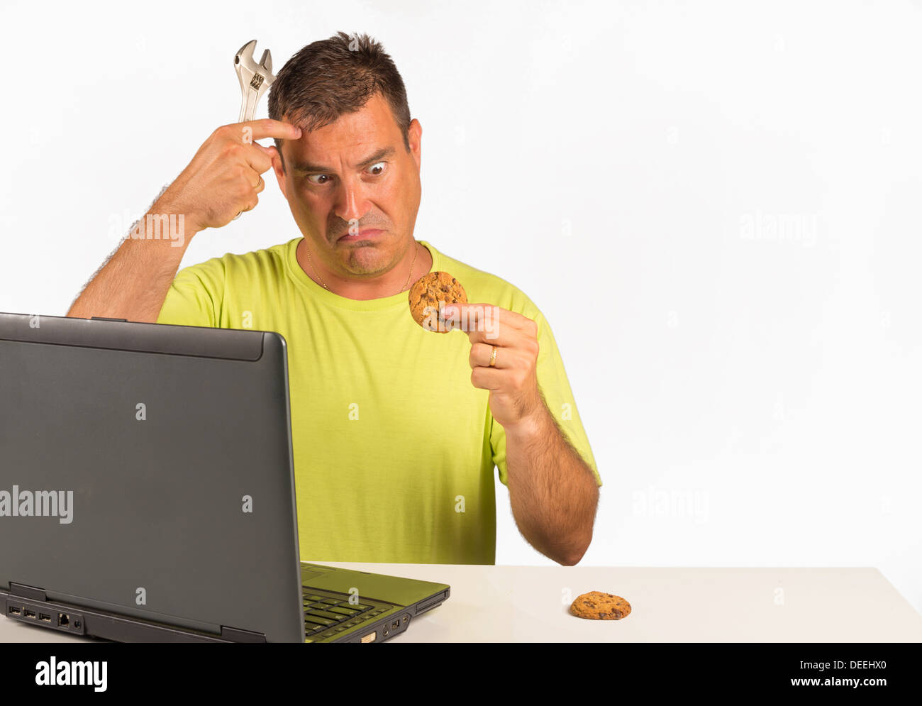 Guy trying to uninstall cookies, a computer dummy concept Stock Photo ...