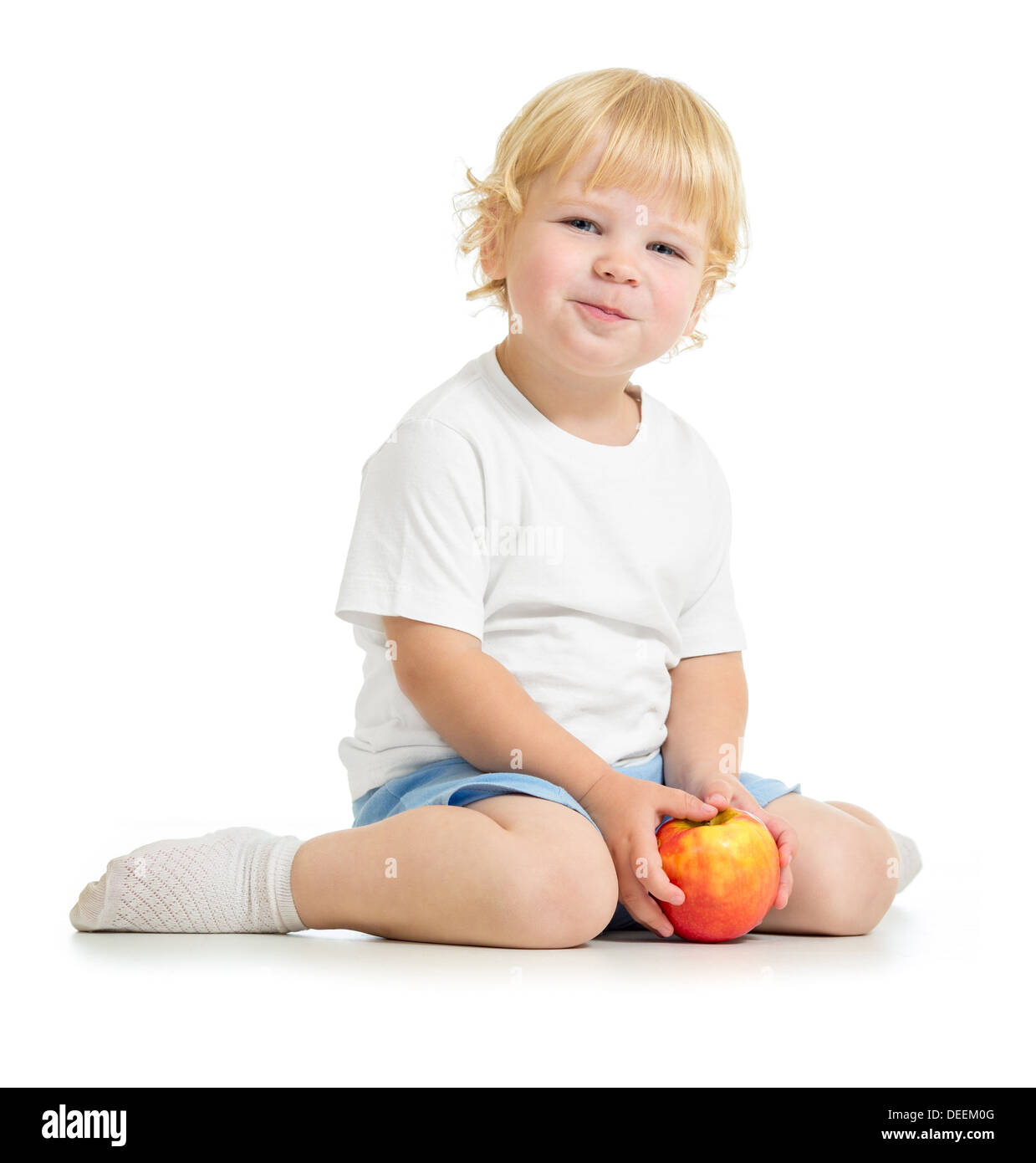 Satisfied kid eating apple Stock Photo - Alamy