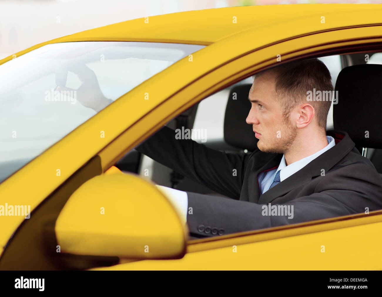 businessman or taxi driver driving a car Stock Photo - Alamy