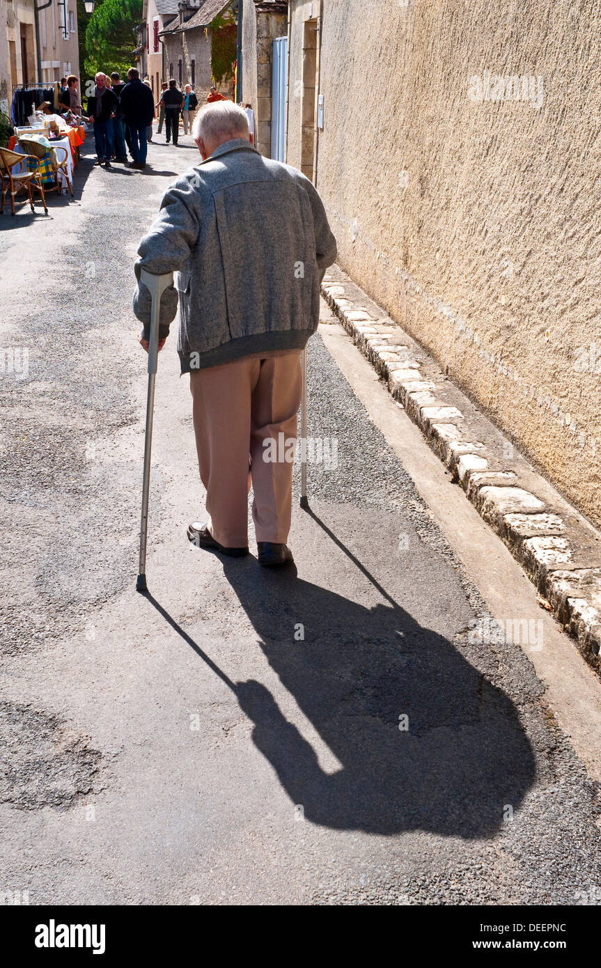 Elderly man with walking sticks / calipers - France Stock Photo - Alamy