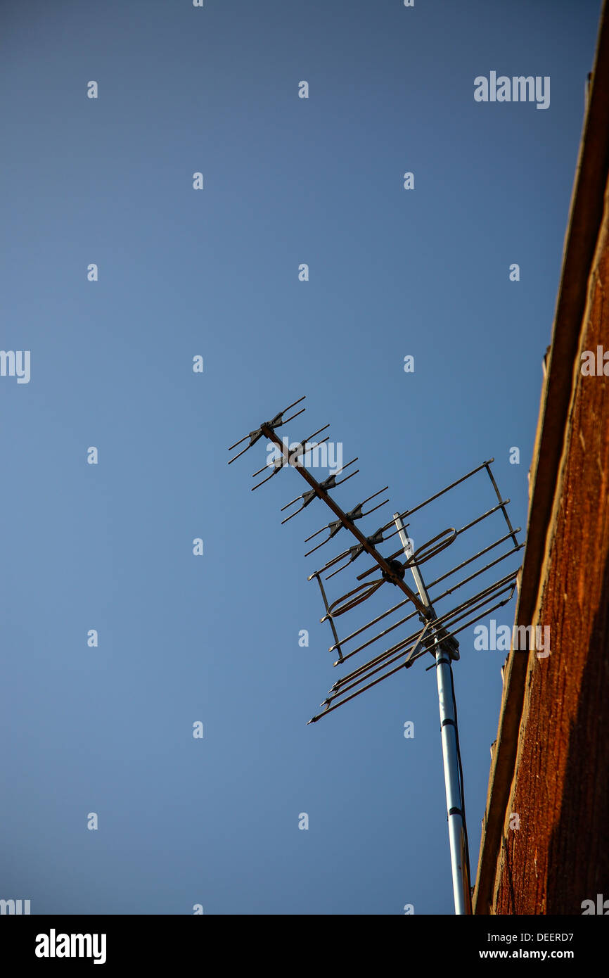 View of television aerial against blue sky Stock Photo - Alamy