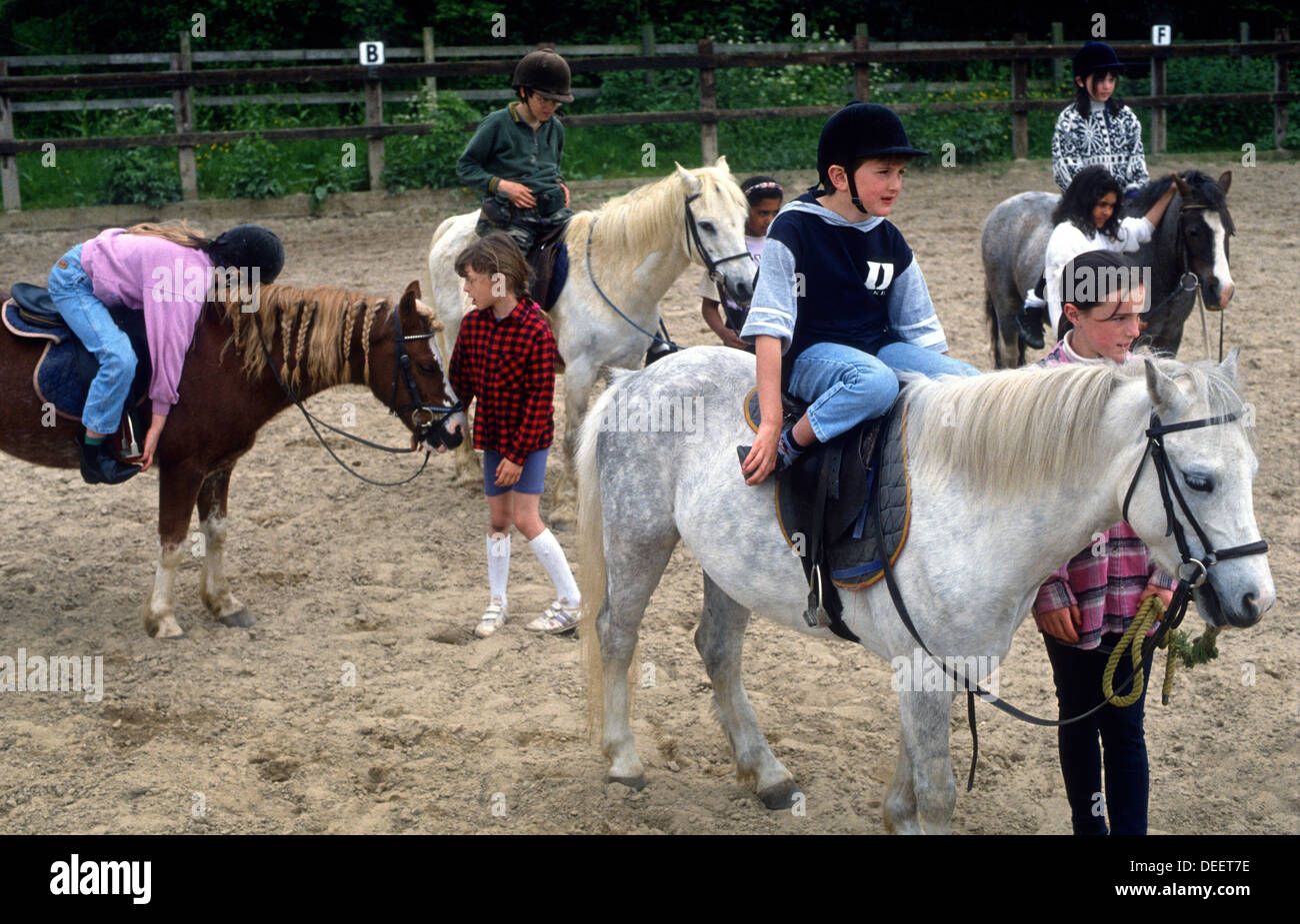 Riding lesson for young children teaching confidence on horseback Stock ...