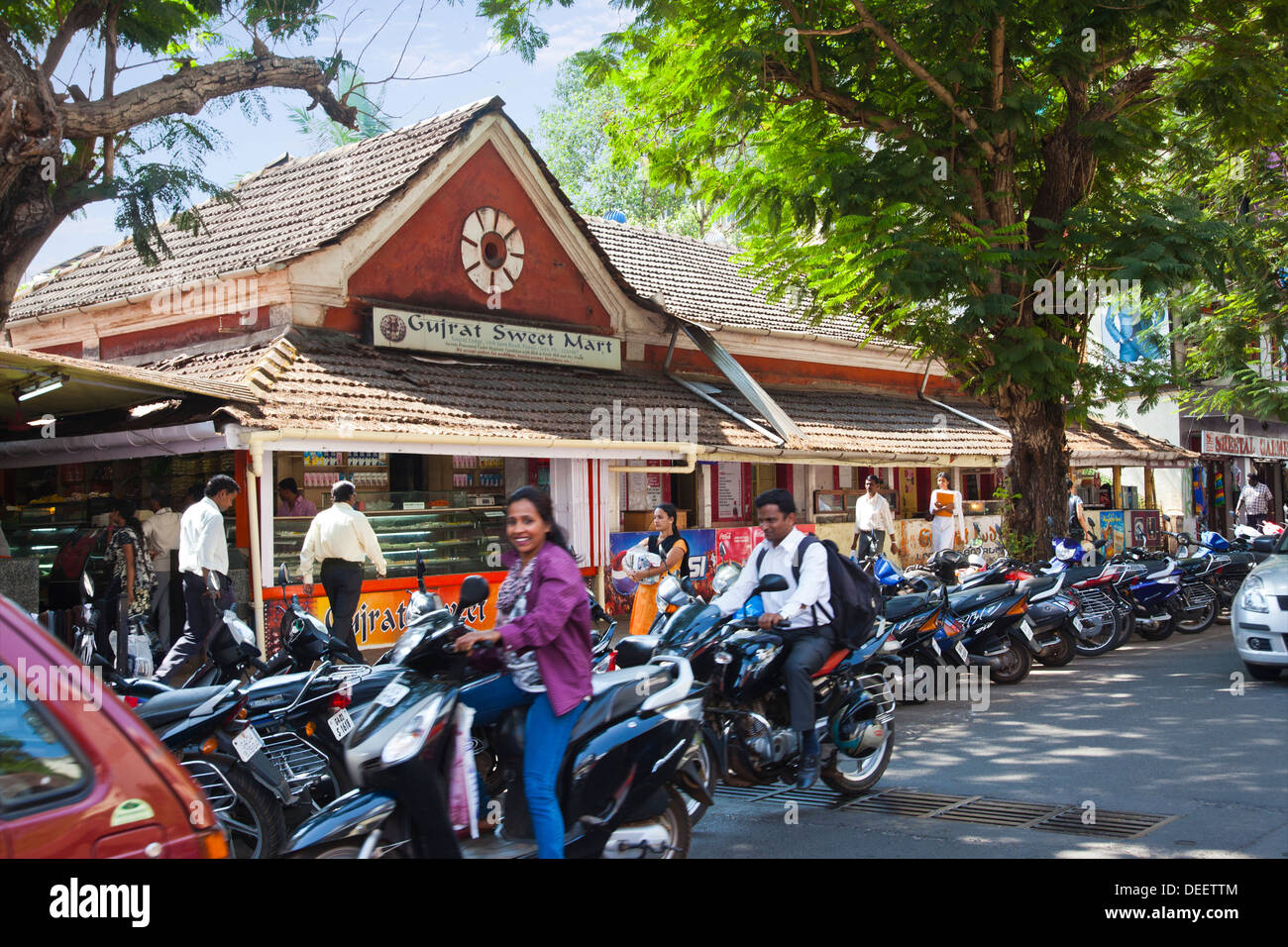 Traffic moving on the road with restaurant in the background, Gujarat ...
