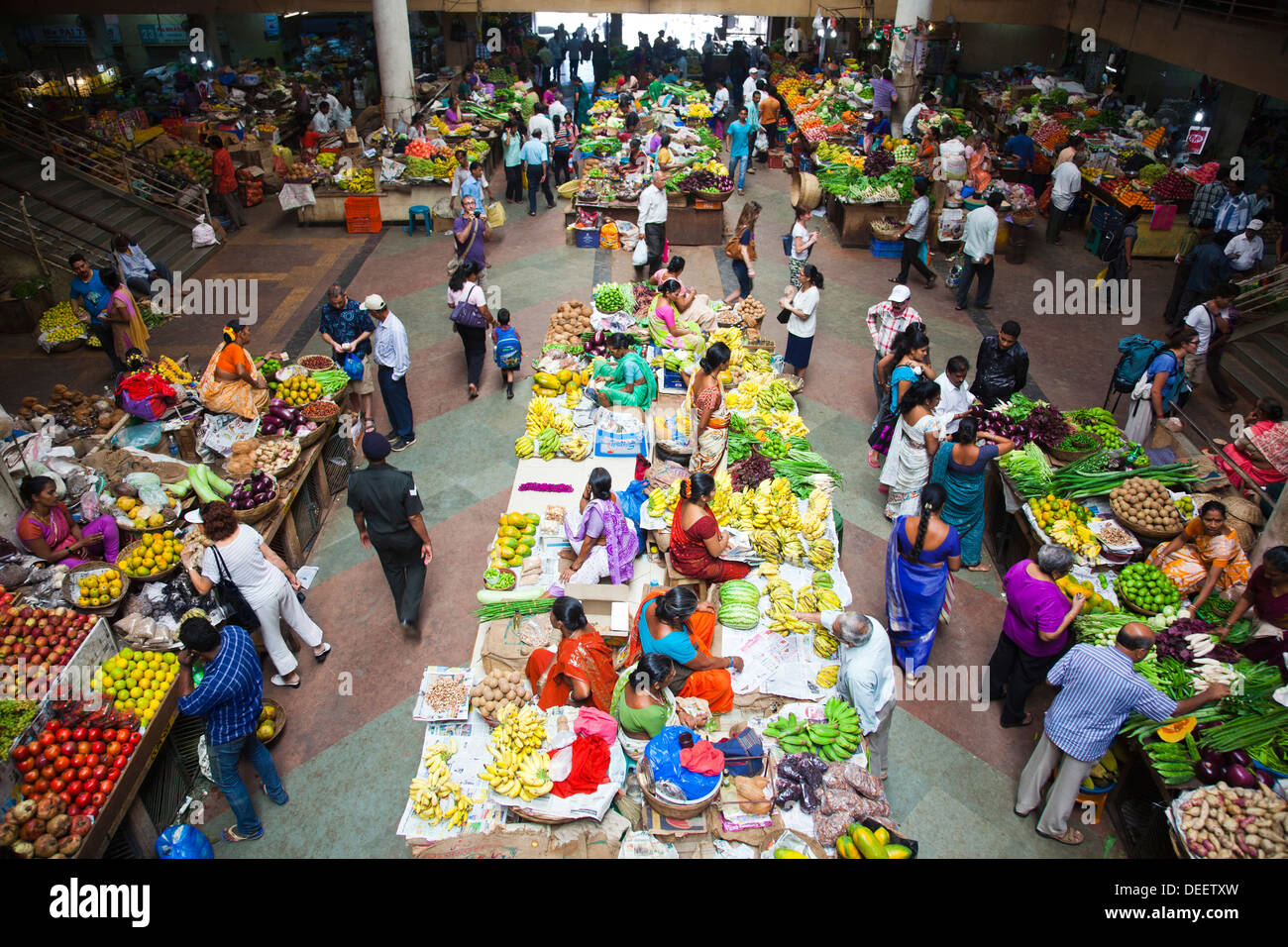 People buying vegetables from a vegetable market, Municipal Market ...