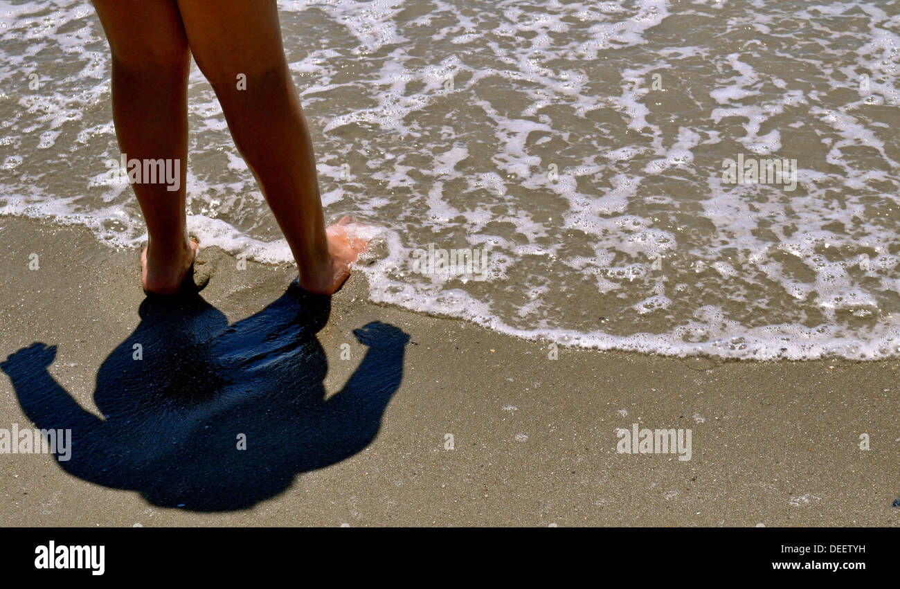 Girl and shadow feel the waves Stock Photo - Alamy