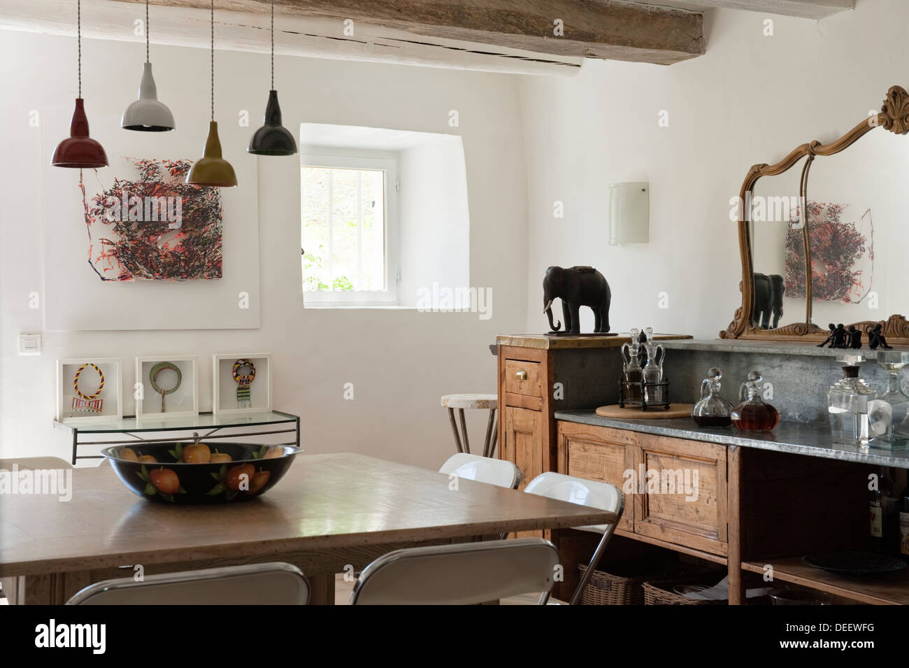 Low beamed ceiling with zinc-topped bar counter and bleached wood ...
