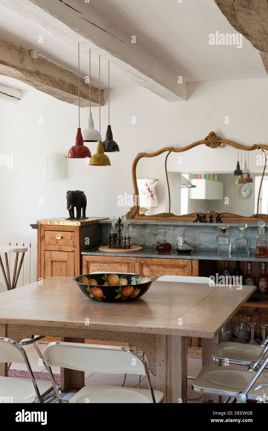 Low beamed ceiling with zinc-topped bar counter and bleached wood ...